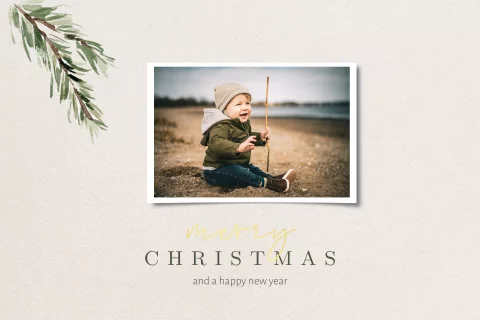 Kerstkaart met eigen foto op een frame en een kersttakje